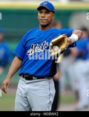The New York Mets' Moises Alou pumps his fist as he runs up the first ...