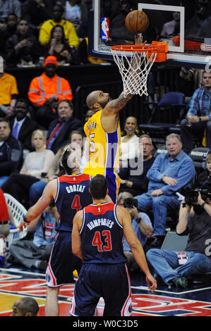 Los Angeles Lakers forward Carlos Boozer dives for a loose ball in the ...