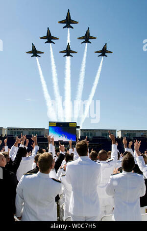 Graduating Midshipmen cheer as the Navy Blue Angels fly over at the ...