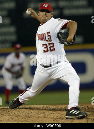 Washington Nationals closer Chad Cordero, left, gets a hug from catcher ...