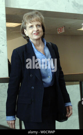 Supreme Court Nominee Harriet Miers shakes hands with Sen. Charles ...