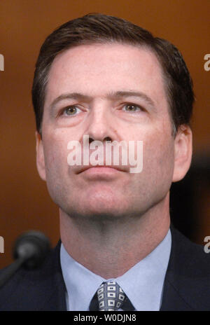 Former Deputy Attorney General James Comey testifies on Capitol Hill in ...