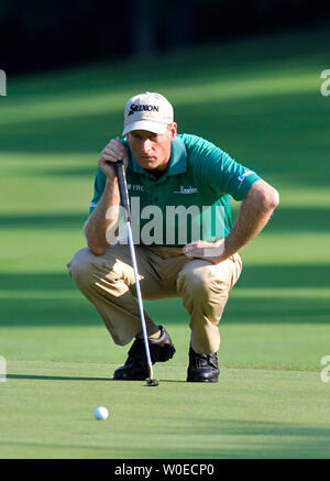 Jim Furyk lines up a putt on the fourteenth green, during the second ...