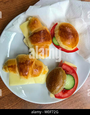 Different types of cheese and fresh bread on dark background Stock ...