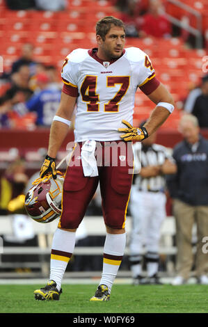 Buffalo Bills tight end Kevin Everett, left, walks through downtown Chicago with friend and ...