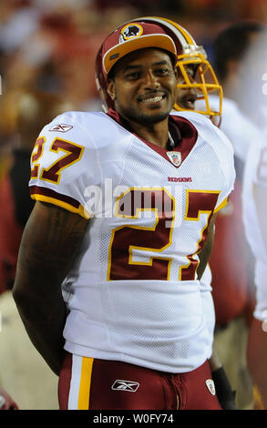 Washington Redskins running back Larry Johnson, left, is stopped for a ...