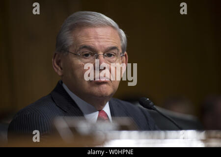 Sen. Bob Menendez, D-N.J., listens during a Senate Banking, Housing ...