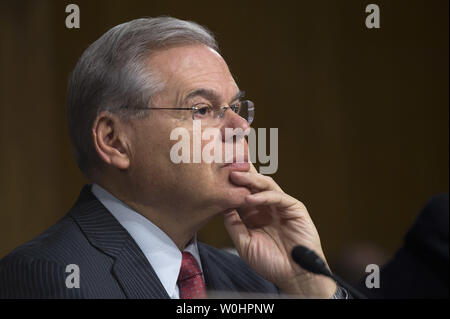 Sen. Bob Menendez, D-N.J., listens during a Senate Banking, Housing ...