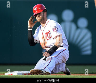 Washington Nationals' Bryce Harper reacts after hitting a foul ball off ...