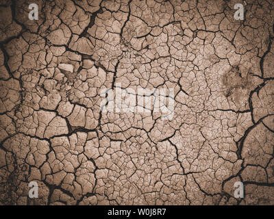 dry cracked brown earth background Stock Photo - Alamy