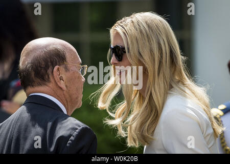 Ivanka Trump greets Commerce Secratary Wilbur Ross in the Rose Garden ...