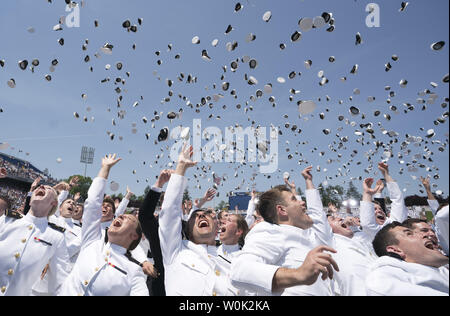 Graduating Midshipmen throw their hats into the air at the end of the ...