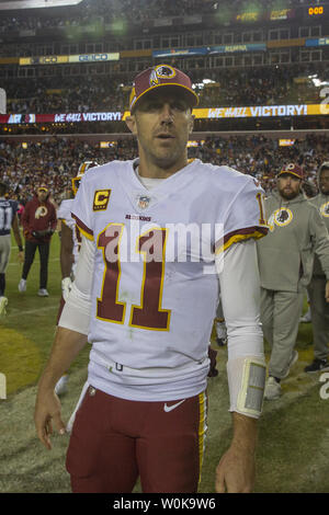 Washington Football Team's Alex Smith warms up before an NFL football ...