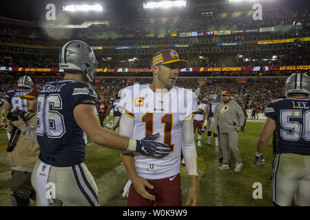 Washington Football Team's Alex Smith warms up before an NFL football ...