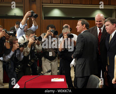 Chief Justice John G. Roberts poses with his family on the front steps ...