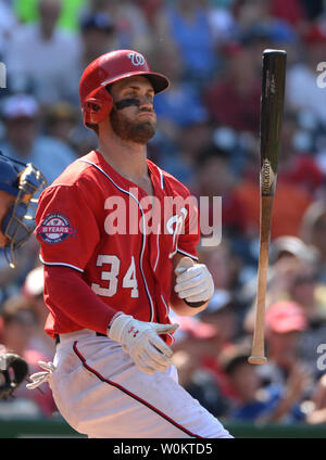 Washington Nationals' Bryce Harper tosses his bat after striking out ...