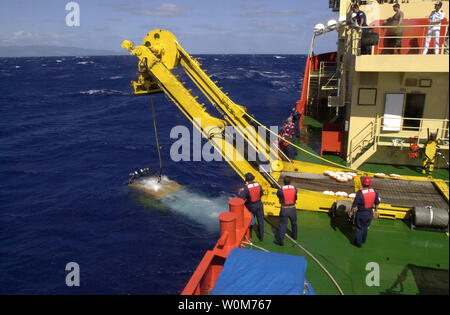 The remotely operated vehicle (ROV) "Scorpio Two" is lowered to the ...