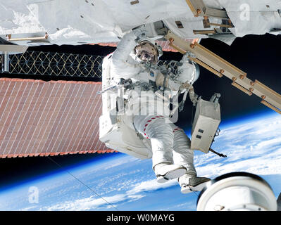 Astronauts Patrick Forrester and Steven Swanson (out of frame), both ...
