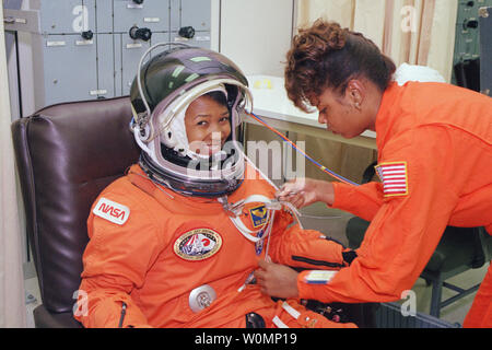 NASA Mission Specialist Mae Jemison looks out the window of the aft ...
