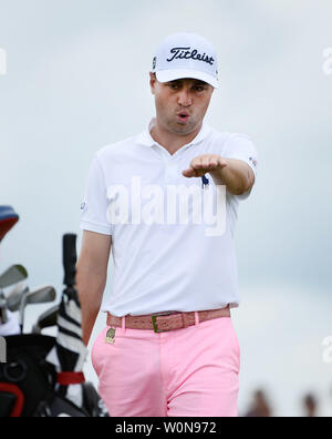 Justin Thomas reacts after his putt on the sixth green during the final ...