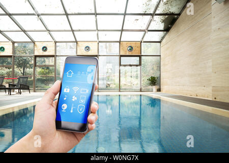 smart phone with smart home with modern swimming pool Stock Photo - Alamy