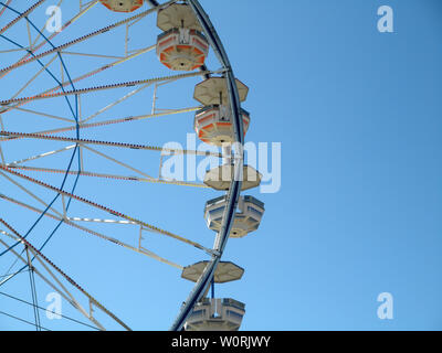 A Ferris wheel is an amusement ride consisting of a rotating upright ...