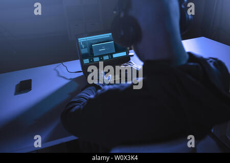 hacker with progress loading bar on computers Stock Photo - Alamy