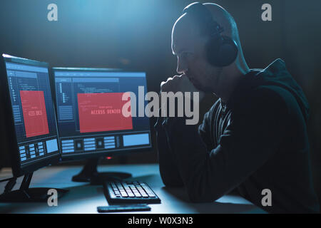 hacker with access denied messages on computer Stock Photo - Alamy