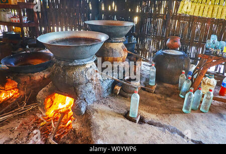 BAGAN, MYANMAR - FEBRUARY 26, 2018: The process of palm brandy ...