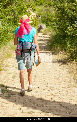 Pilgrim walking along the route of the Camino de Santiago, Northern ...
