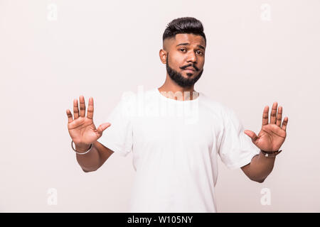 Young man make a pause in front of painted doors in the Old city of ...
