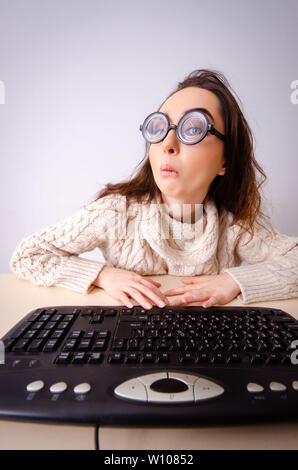 Funny nerd gamer girl posing with gaming keyboard, playing computer ...