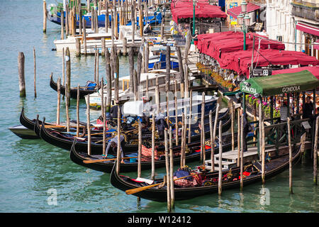 VENICE, ITALY - APRIL, 2018: The beautiful canals, bridges and gondolas ...