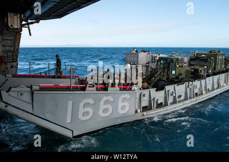 Landing Craft Utility (LCU) 1666, assigned to Naval Beach Unit (NBU) 7 ...