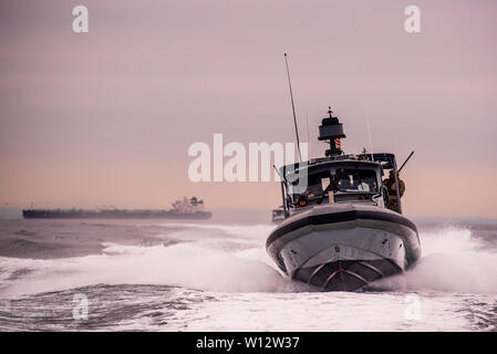 A SeaArk 34-foot Dauntless patrol boat provides security for a U.S ...