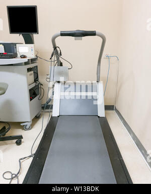 Hospital treadmill with heart monitor Stock Photo - Alamy