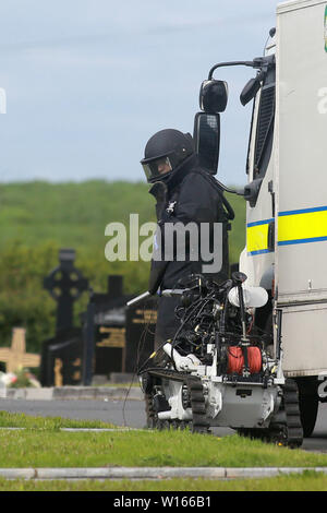 Army Bomb Disposal team are seen in the grounds of St. Coleman's ...