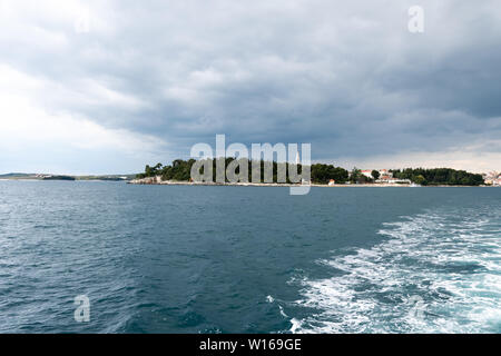 Red Island near Rovinj, Croatia with seaside holiday resort and beach ...