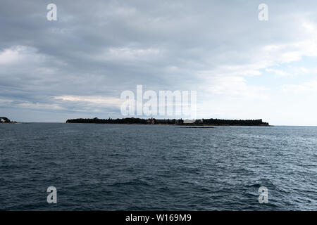 Red Island near Rovinj, Croatia with seaside holiday resort and beach ...