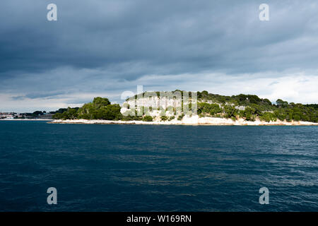 Red Island near Rovinj, Croatia with seaside holiday resort and beach ...
