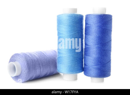 Bright sewing threads on white background Stock Photo - Alamy