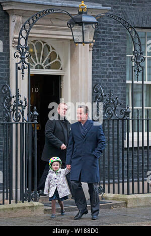 Prime Minister David Cameron walking his son Arthur to school London ...