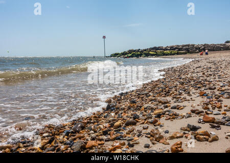 The water's edge on Avon Beach, Mudeford, Christchurch, Dorset, UK on a ...