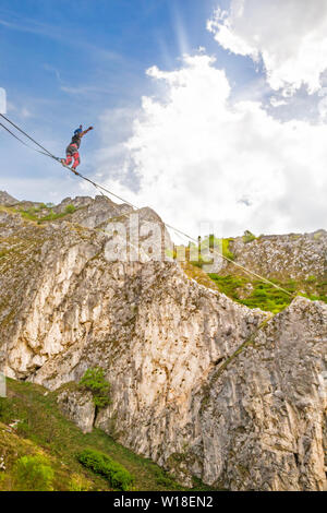 Highliner on a rope. Highline on a background of mountains. Extreme ...