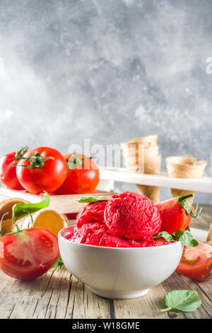 Vegetable gelato. Tomato ice cream with fresh tomatoes and basil and ...