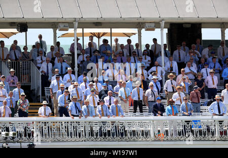 Members of the MCC, the Marylebone Cricket Club, queue for seats at a ...