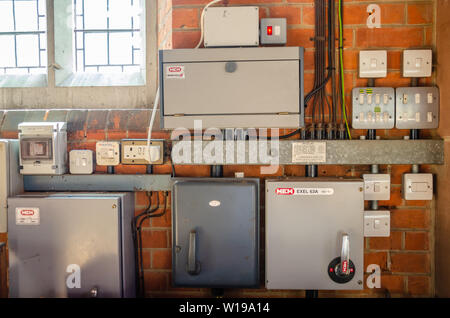 Wall mounted industrial electrical power socket and fuse box with plugs ...