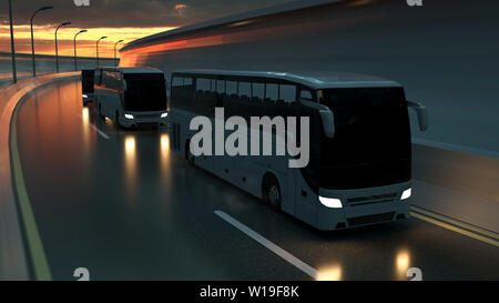 A convoy of three white buses drive on a highway at sunset backlit by a ...