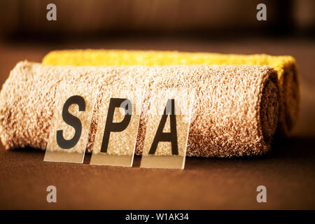 Chocolate Spa . Composition brown towel in hotel room of spa treatment ...
