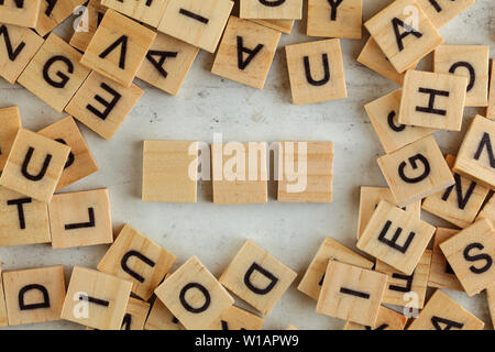 Alphabet letter wooden blocks tiles Valentine`s day on white background ...